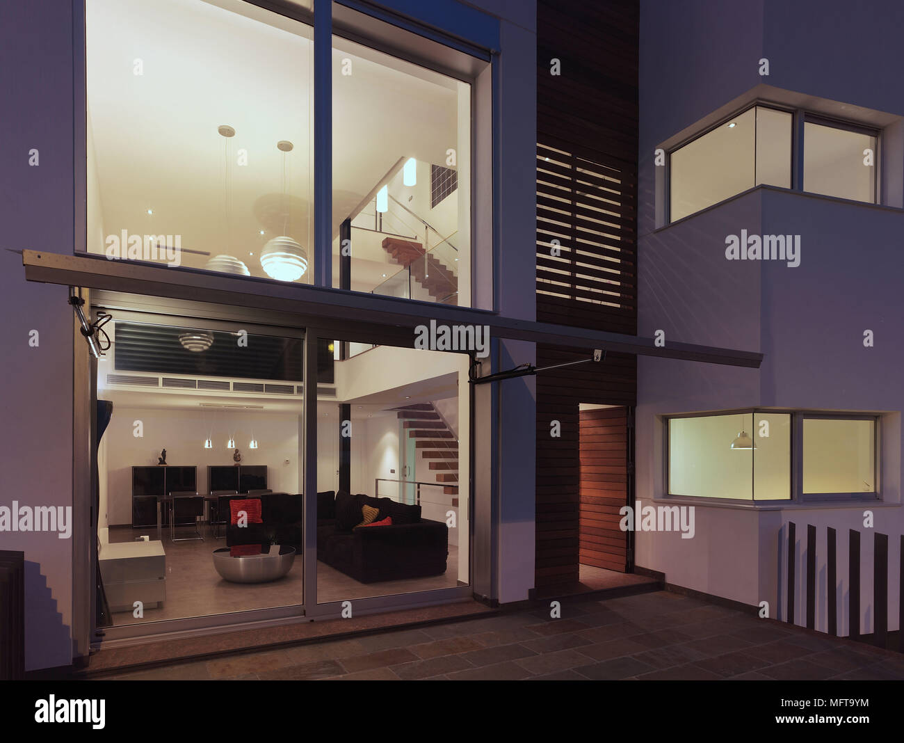 Exterior of modern house at night Stock Photo - Alamy