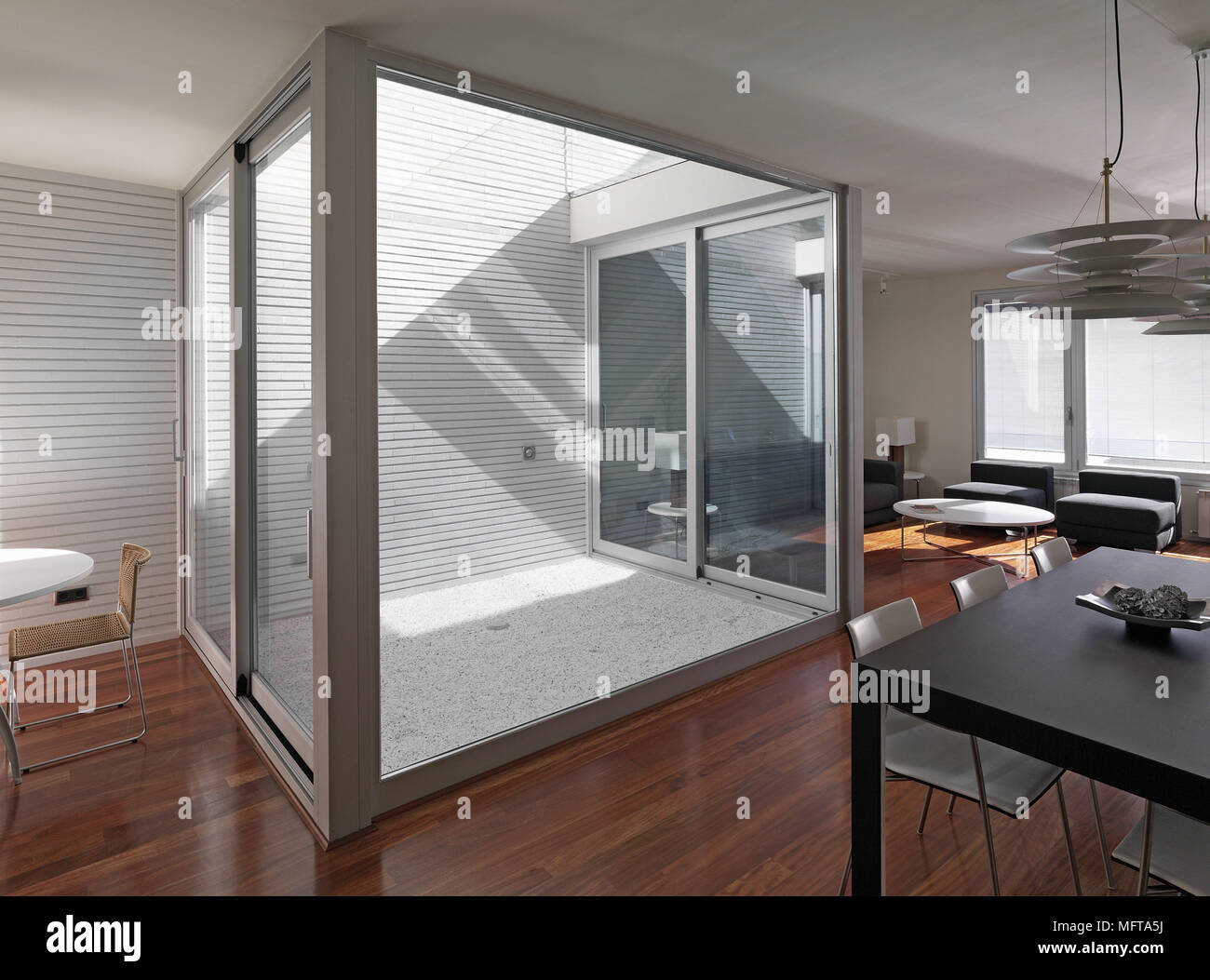 Interior architectural feature with glass panels and sliding doors in ...