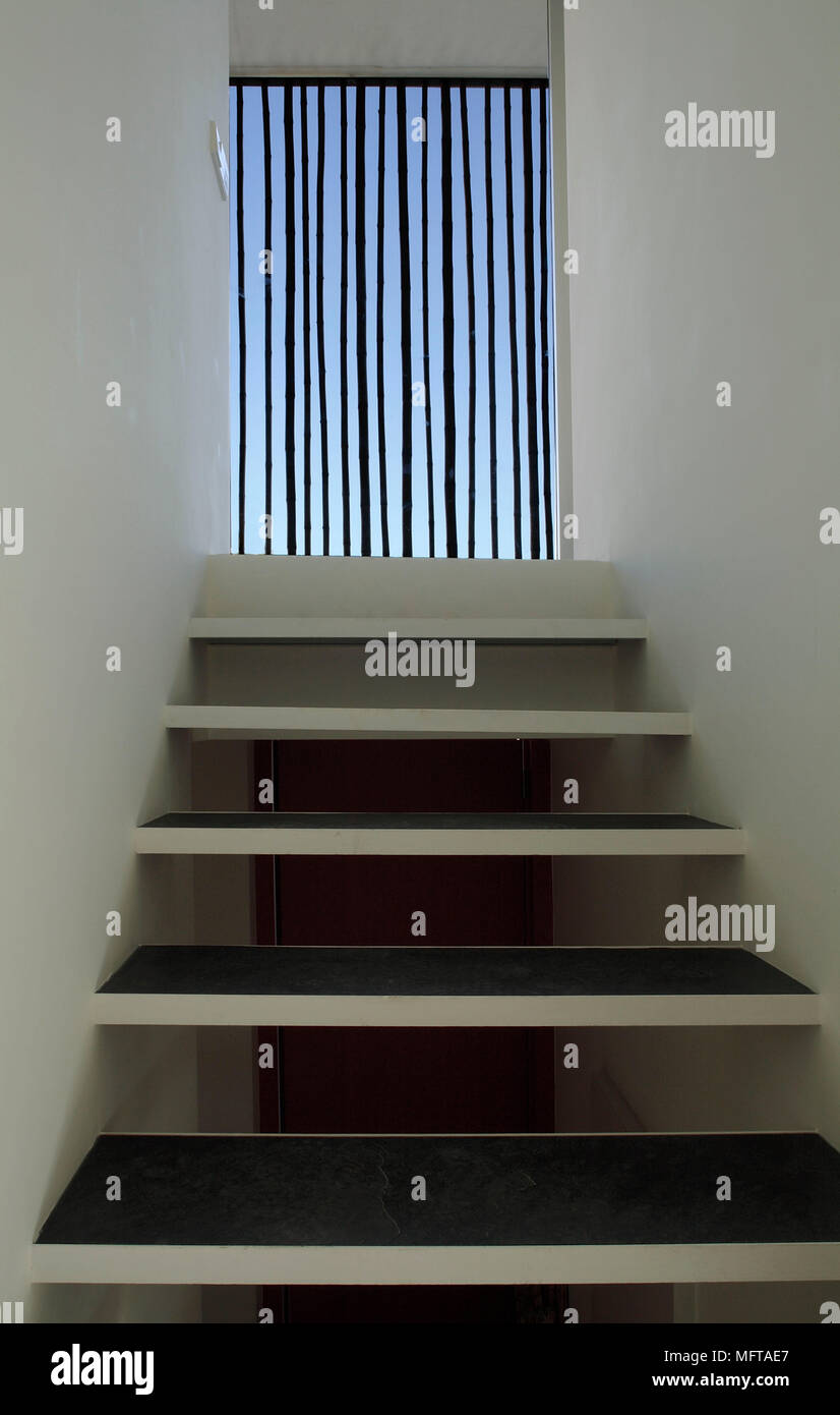 View from below of contemporary staircase with window at top Stock ...