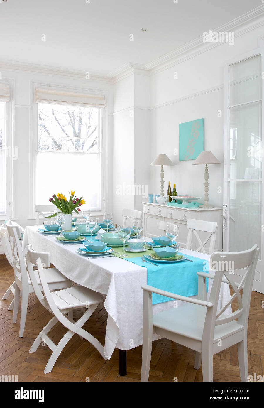Table laid for dinner in traditional style dining room Stock Photo - Alamy