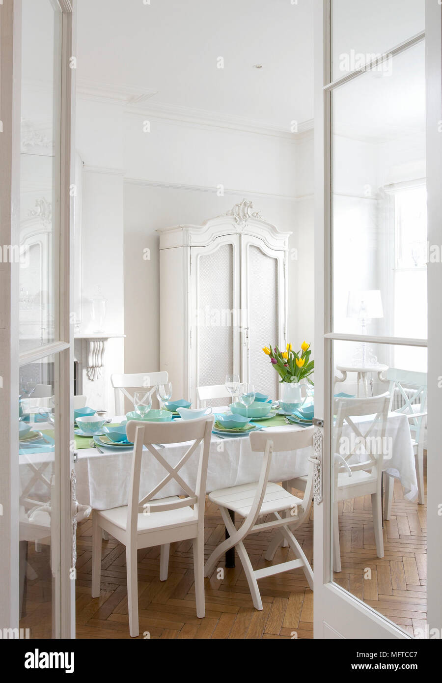 Table laid for dinner in traditional style dining room Stock Photo - Alamy