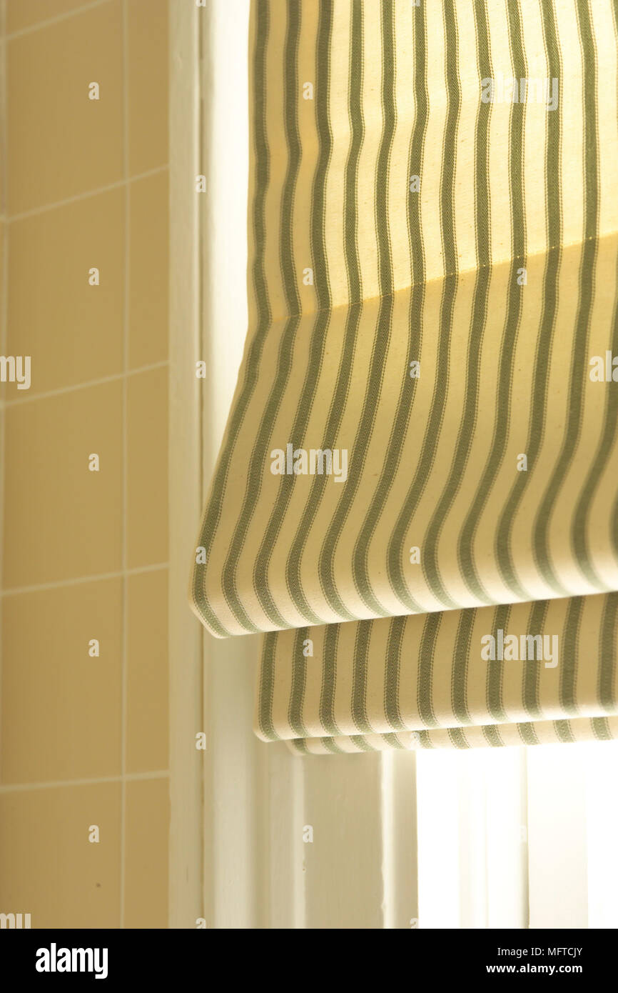 Striped roman blind Stock Photo - Alamy