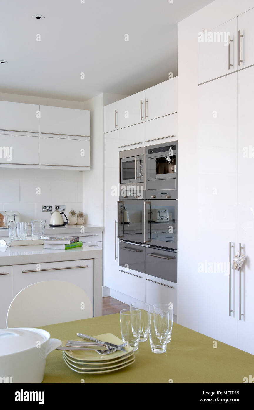 Modern kitchen with white fitted units Stock Photo - Alamy