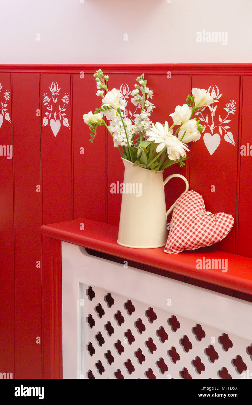 Flower arrangement on radiator cover Stock Photo - Alamy