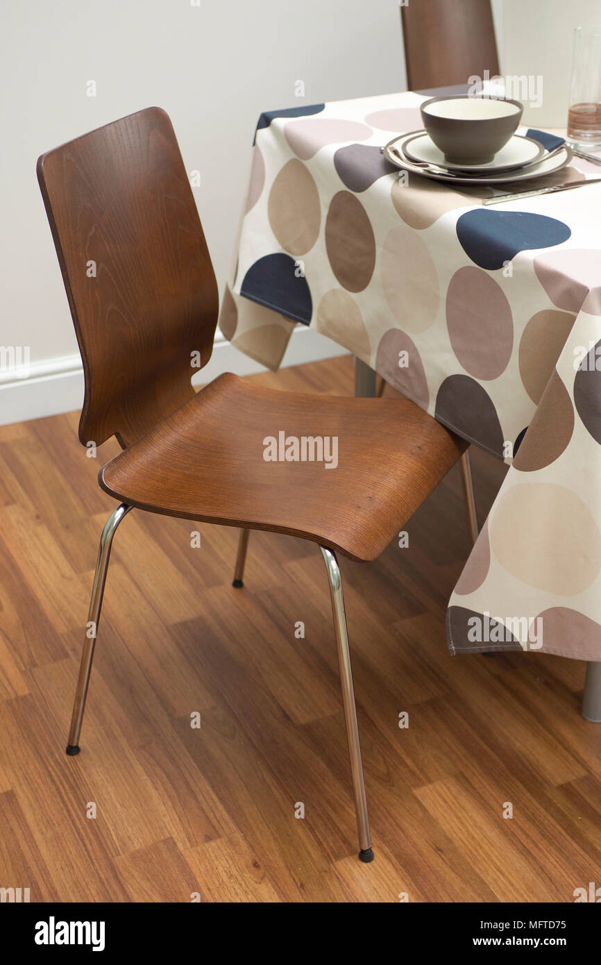 Wooden chair at modern dining table Stock Photo - Alamy