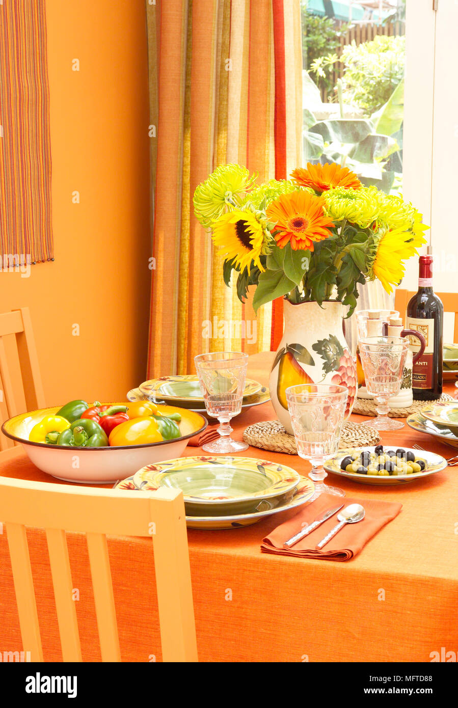 Table set for dinner in modern dining room Stock Photo - Alamy