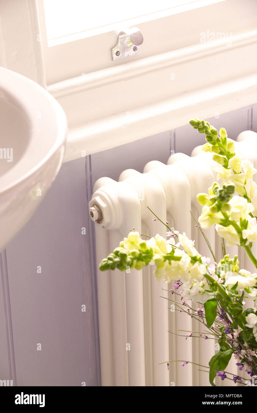 Radiator below window Stock Photo - Alamy