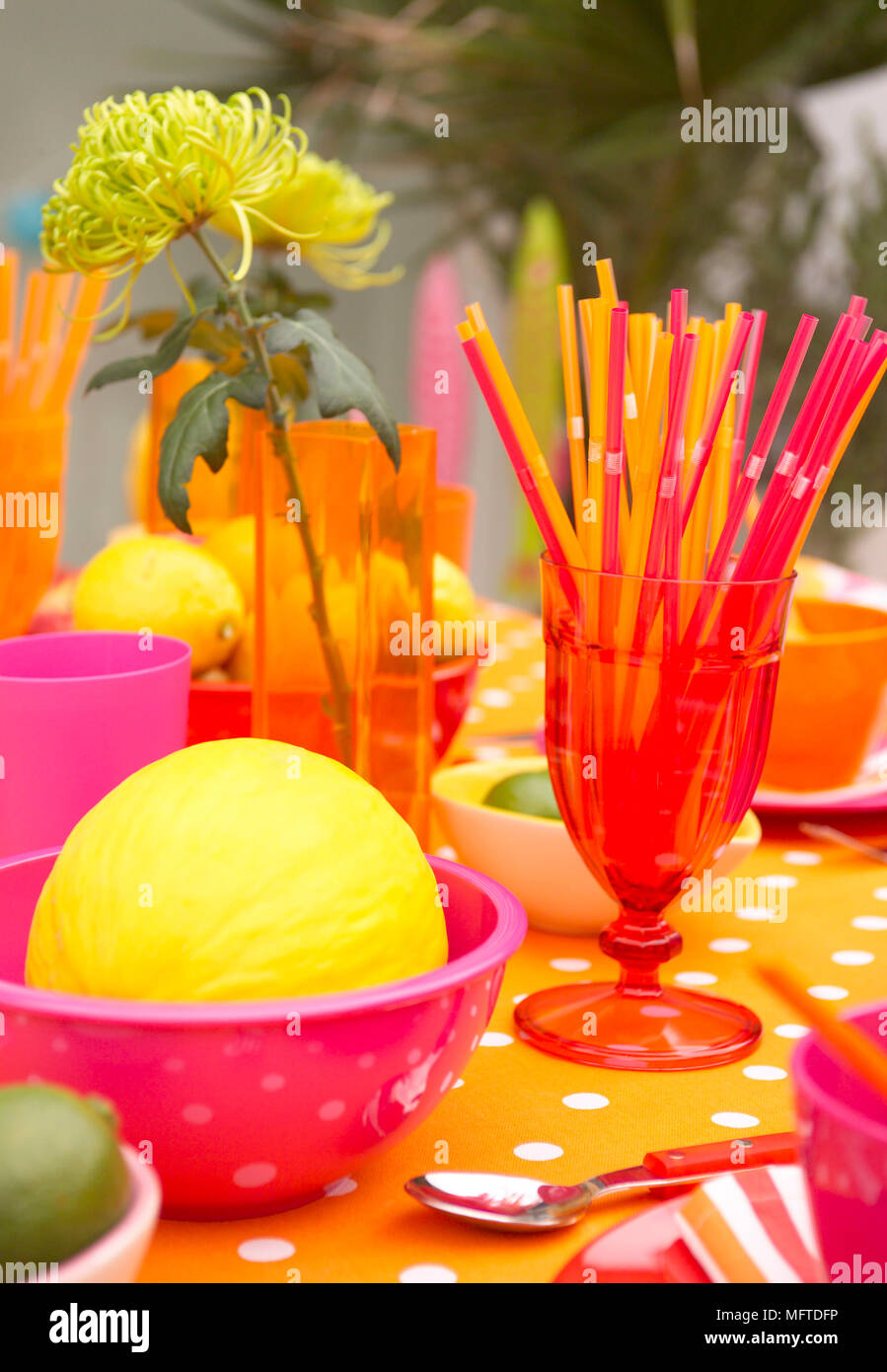Table laid for lunch with brightly coloured tableware Stock Photo - Alamy