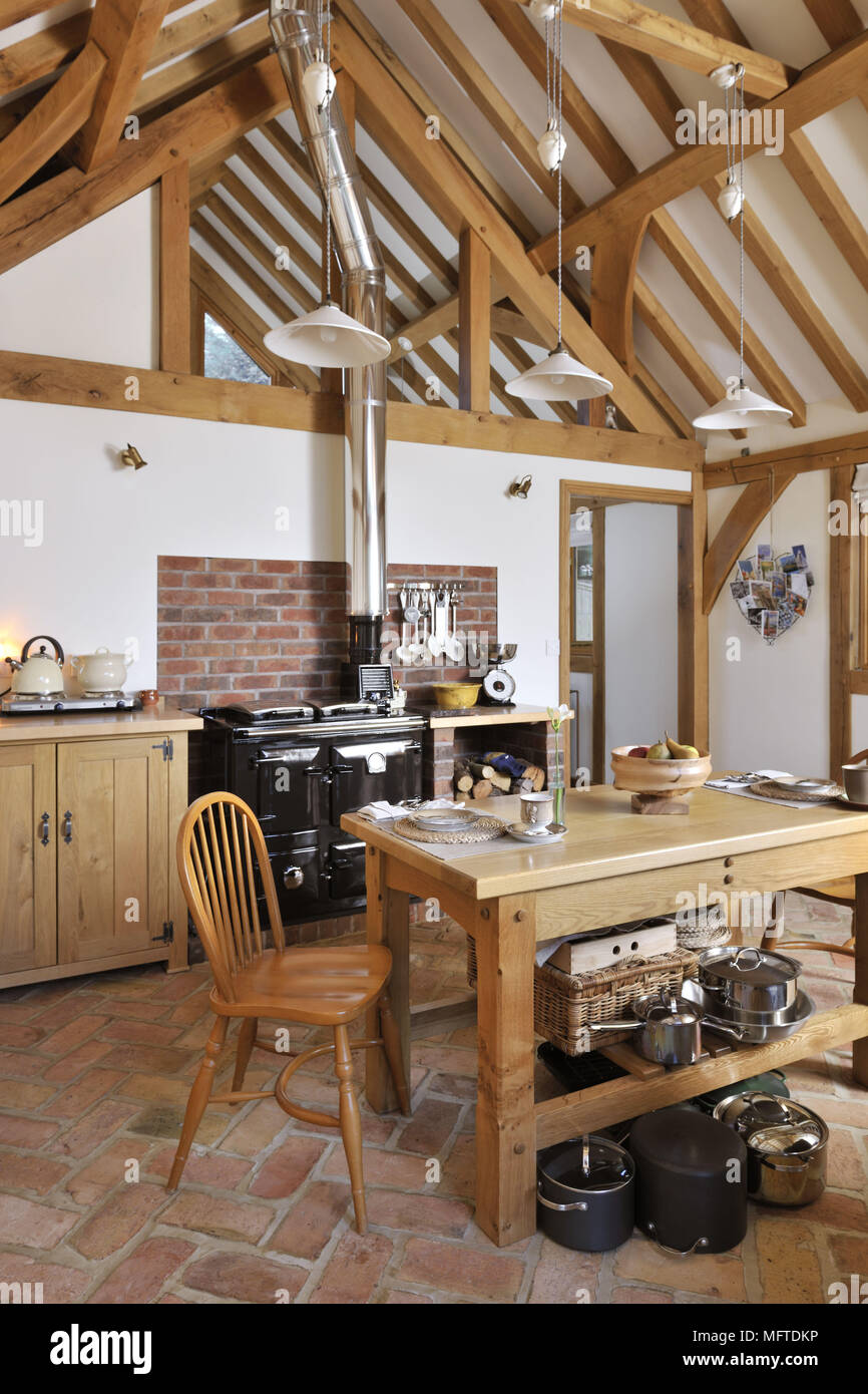Breakfast table in country style kitchen Stock Photo - Alamy