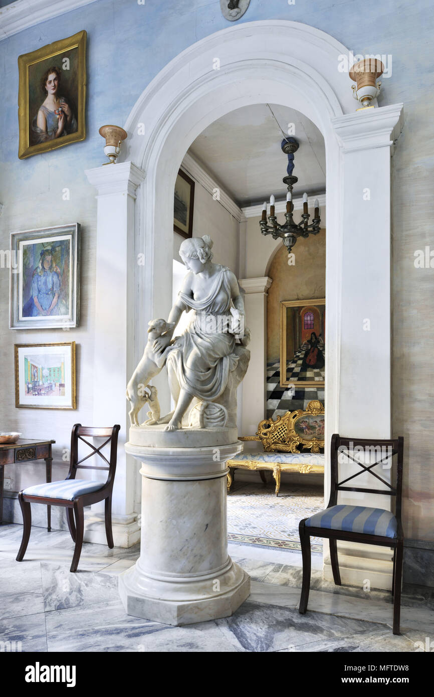 Marble statue in grand room Stock Photo - Alamy