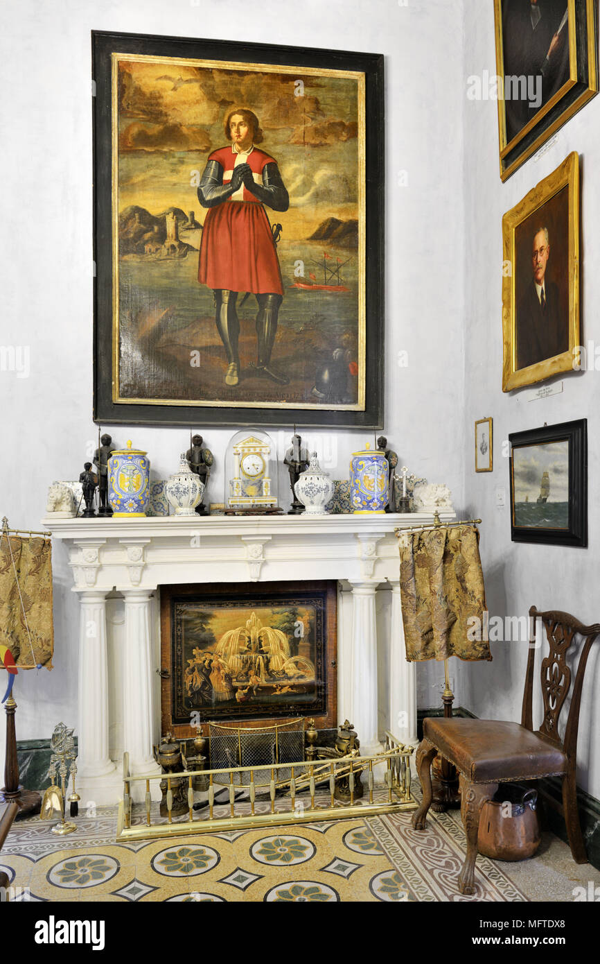 Period portrait above fireplace in traditional style room Stock Photo ...