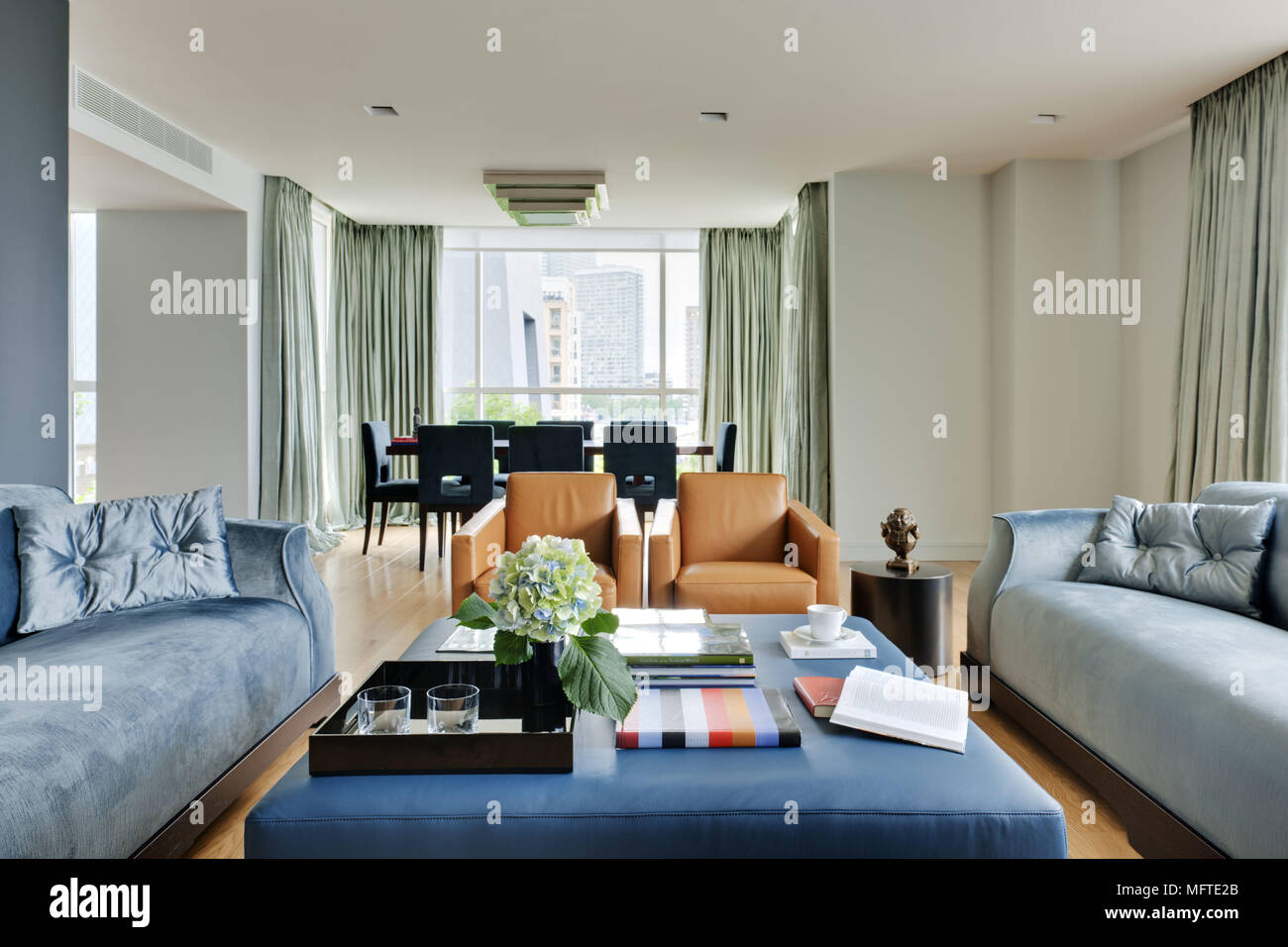 Upholstered seating around coffee table in modern sitting room Stock ...