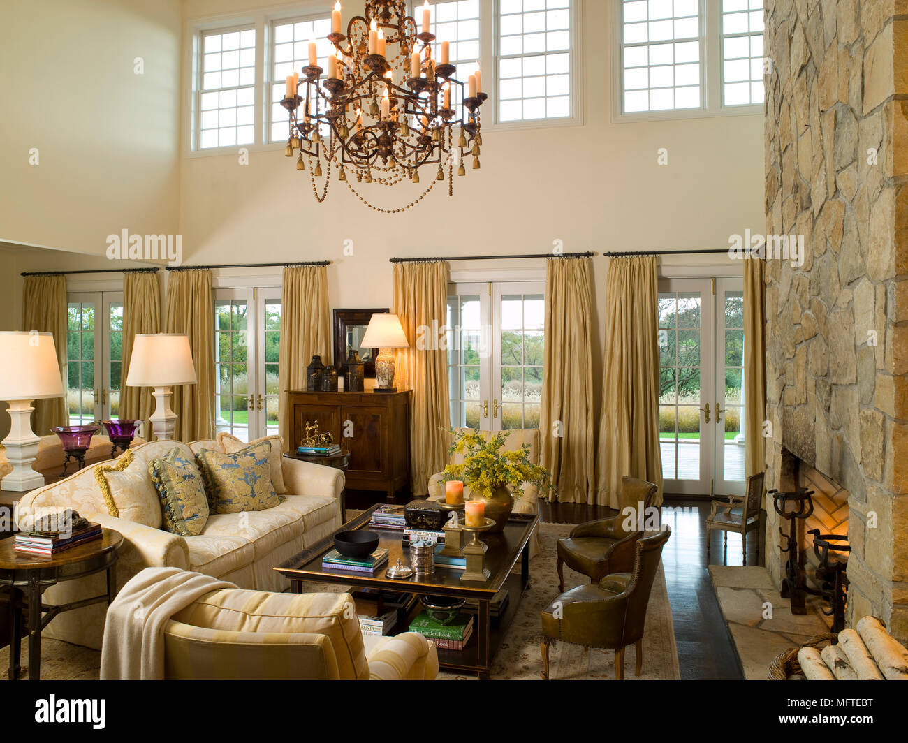 Upholstered seating around coffee table in opulent sitting room Stock ...