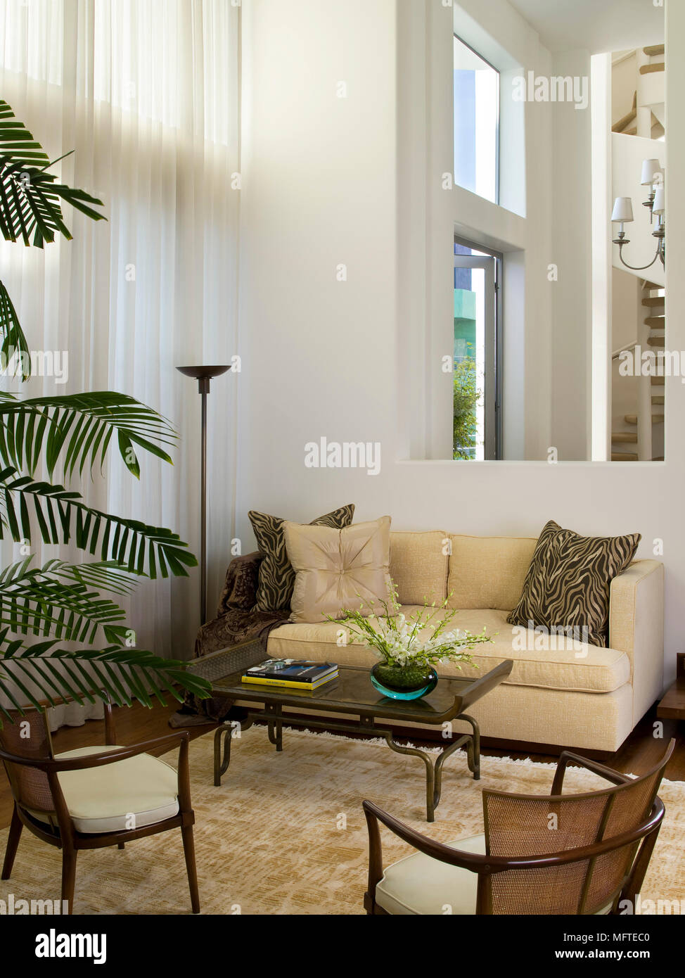 Coffee table in front of upholstered sofa in modern sitting room Stock ...