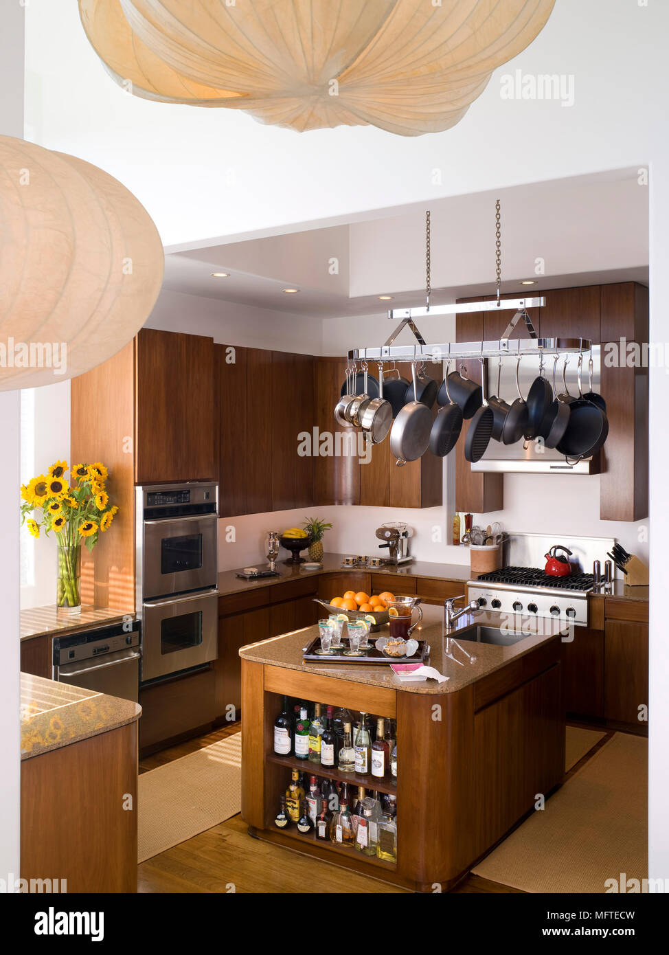 Hanging Pots And Pans Over Island