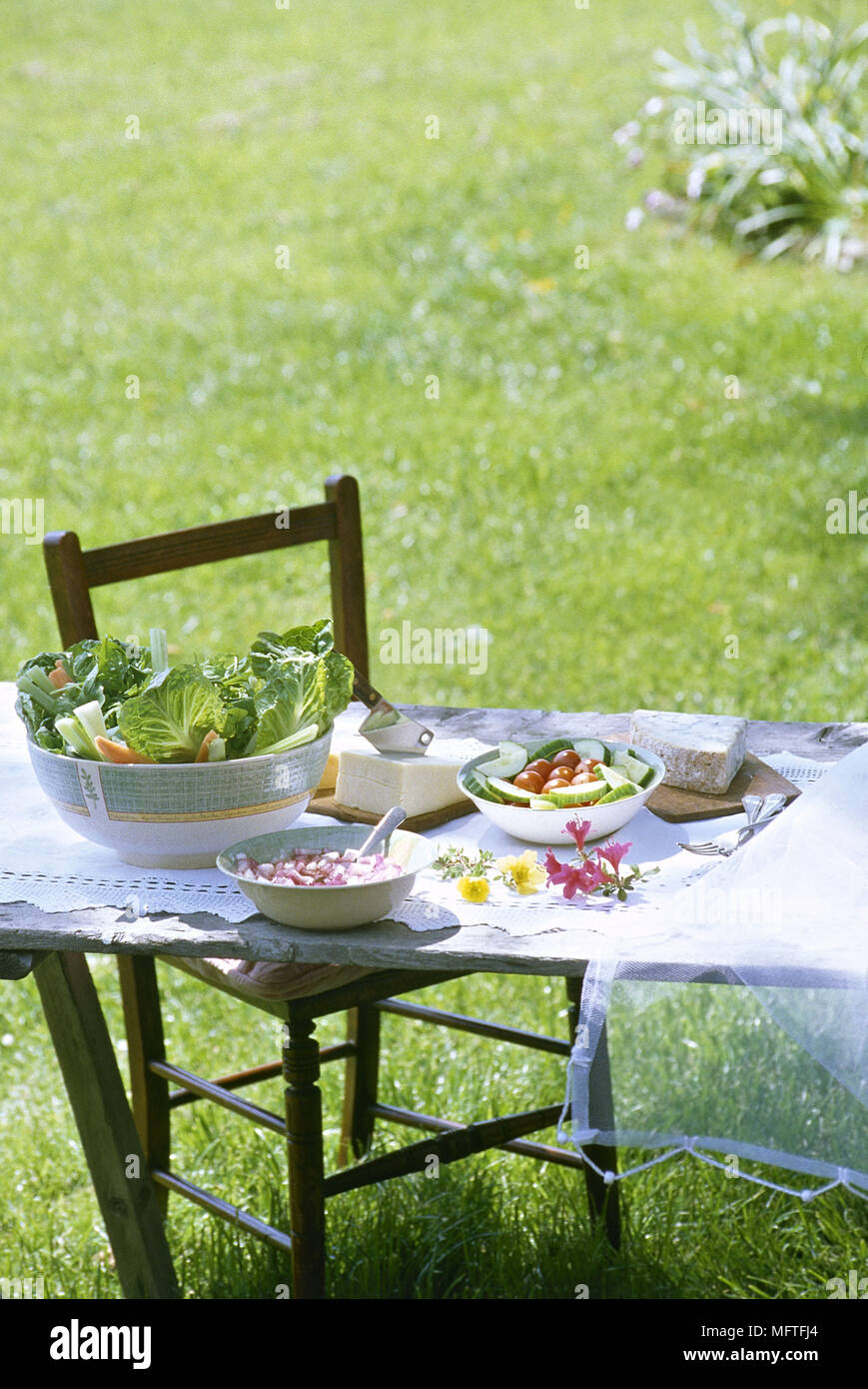 Outdoor table set for lunch in garden Stock Photo - Alamy