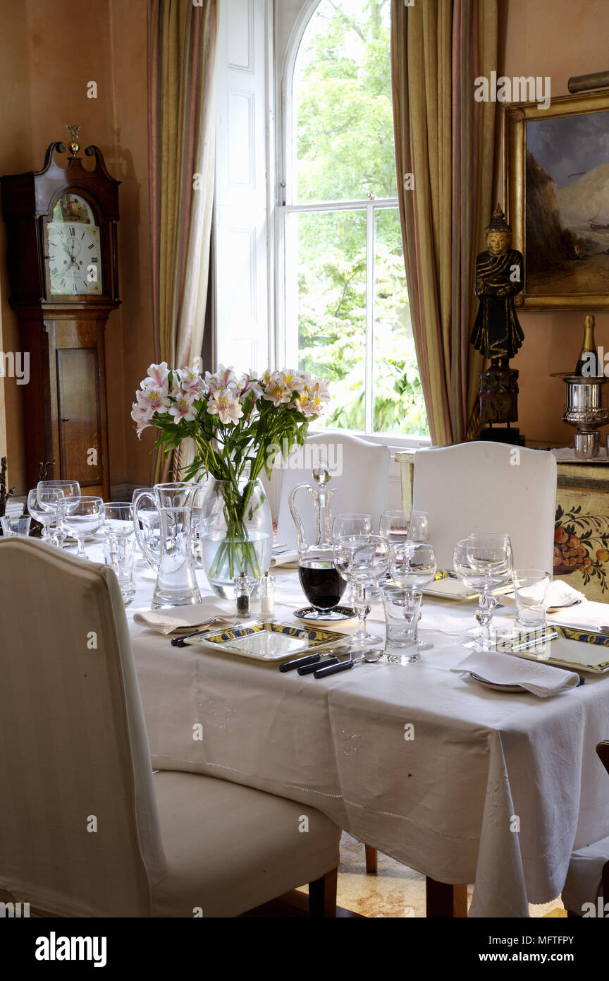 Table set for dinner in traditional style dining room Stock Photo - Alamy