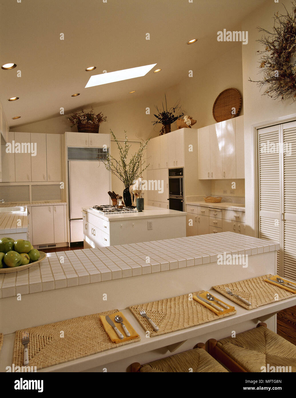 Modern kitchen white units tiled worktops central island unit breakfast ...