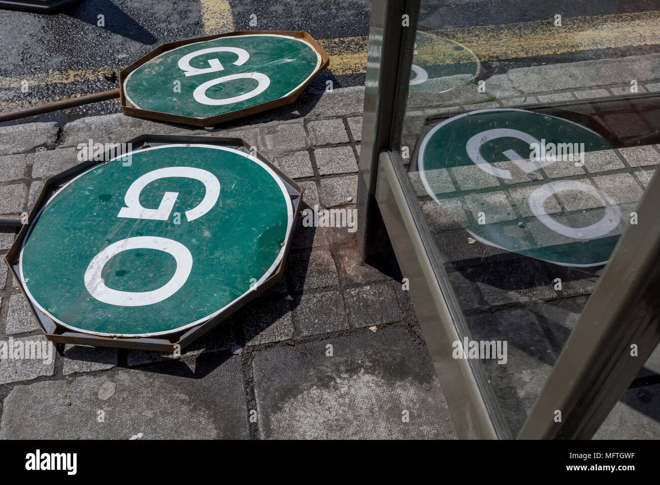 Two GO traffic road signs lie by the road in East Dulwich, on 26th ...