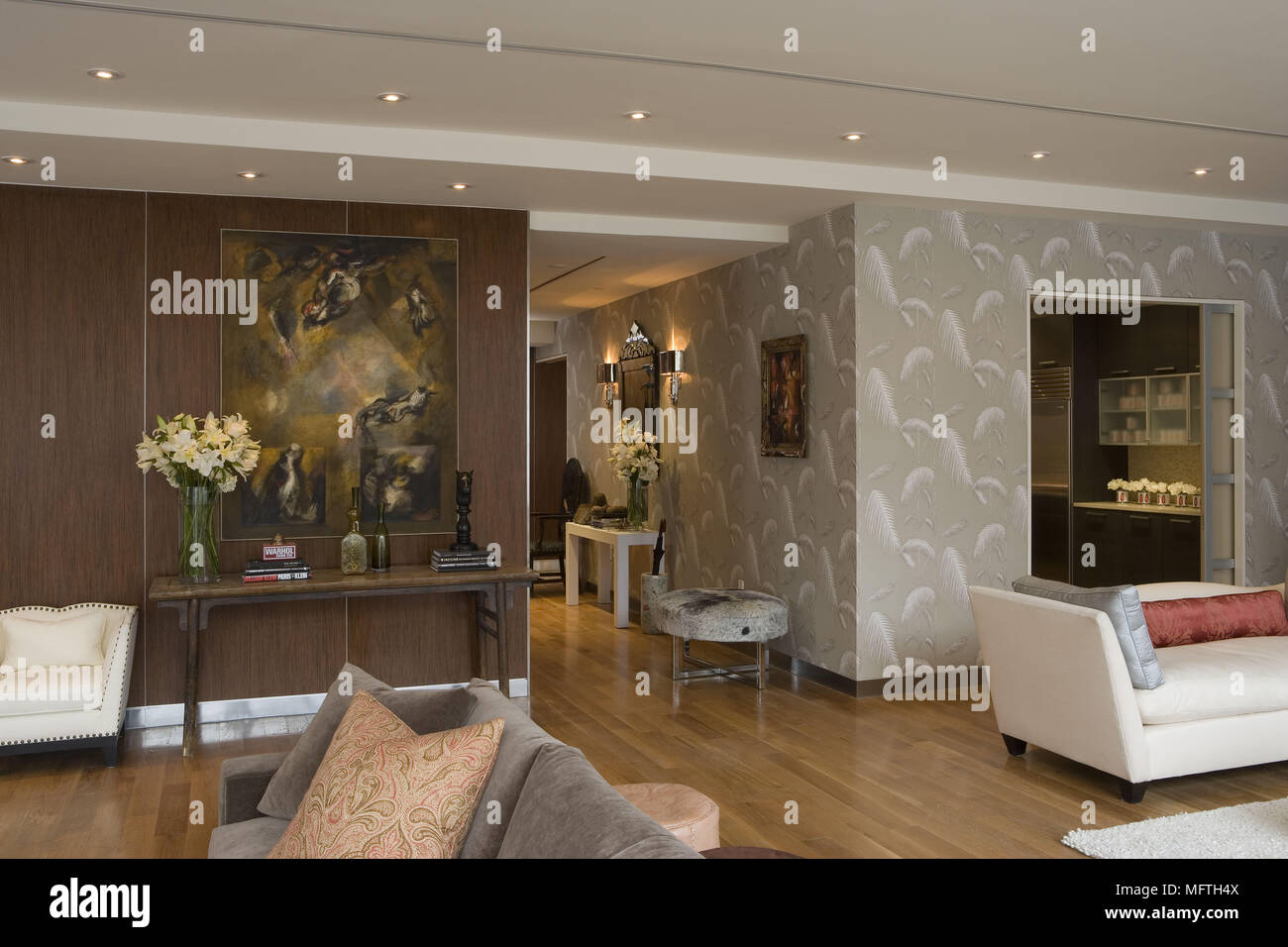 Artwork above side table in modern open plan sitting room Stock Photo ...