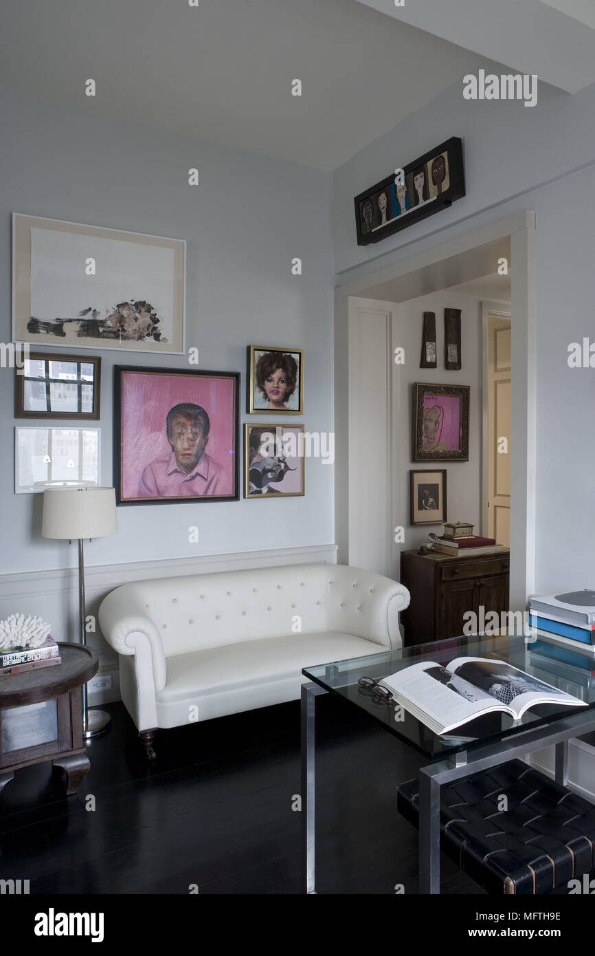 Glass topped table facing white sofa in modern room Stock Photo - Alamy