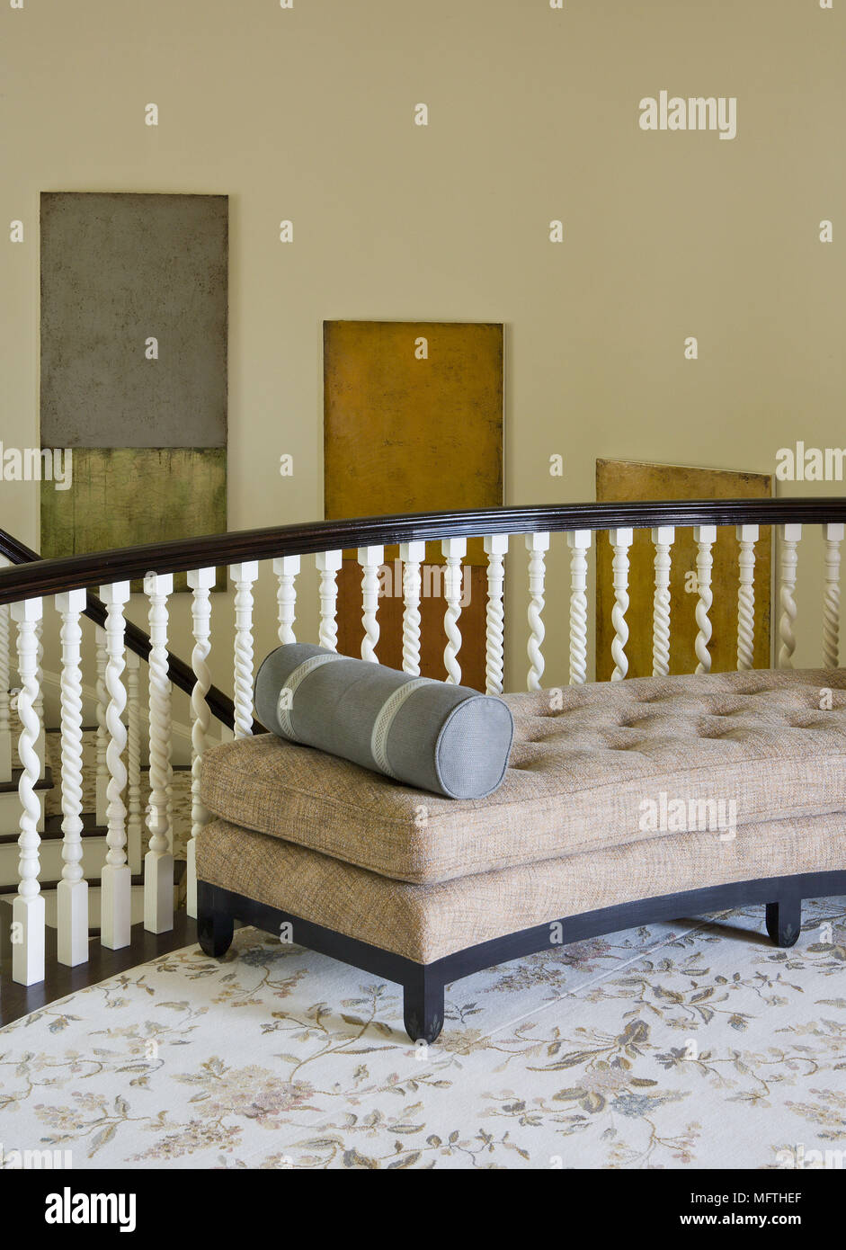 Upholstered daybed on traditional style landing Stock Photo - Alamy
