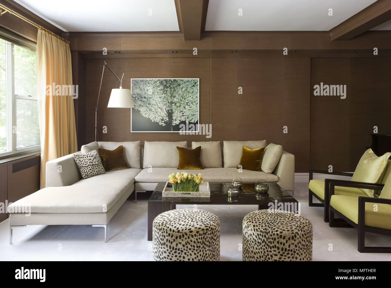 Upholstered seating around coffee table in modern sitting room Stock ...