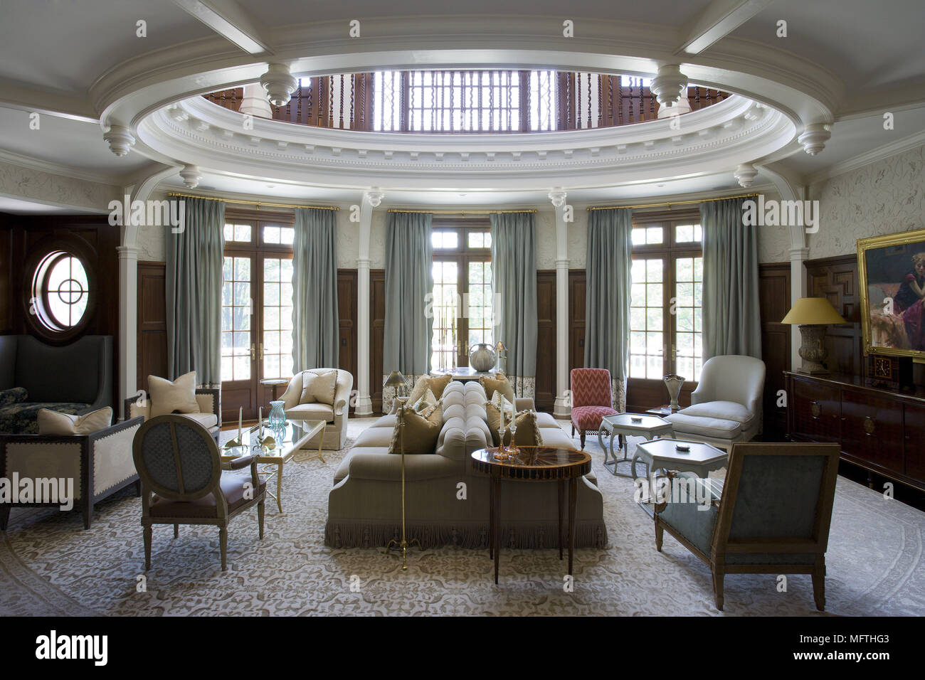Upholstered seating in spacious opulent sitting room with atrium Stock ...