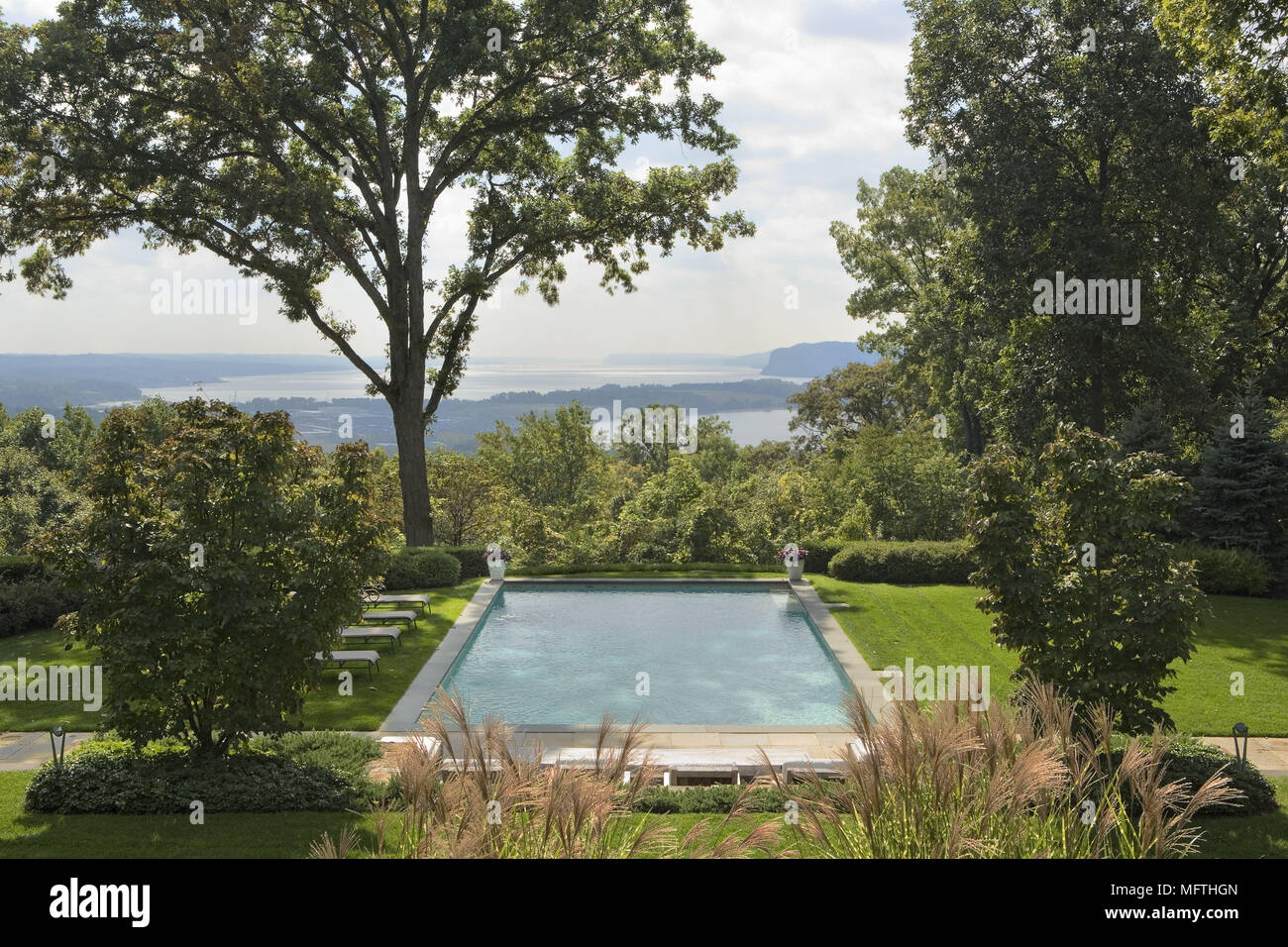 View overlooking swimming pool in grounds Stock Photo - Alamy