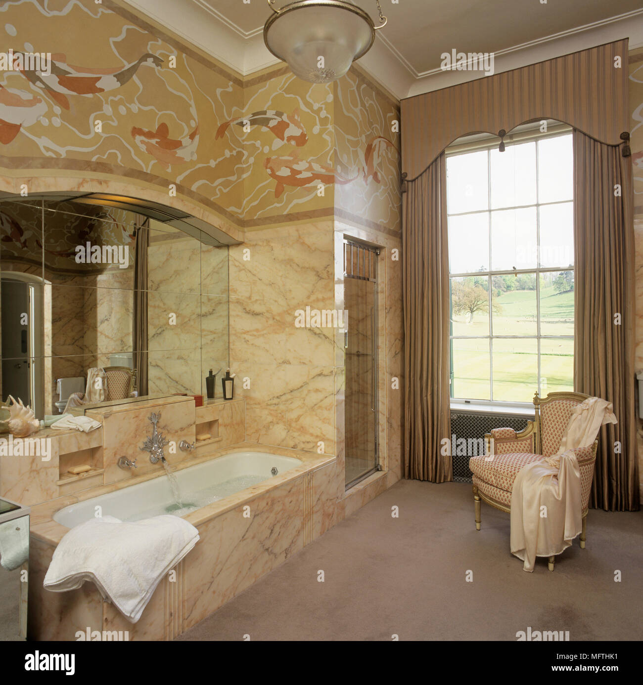 Opulent marble bathroom with bathtub and shower cubicle Stock Photo - Alamy
