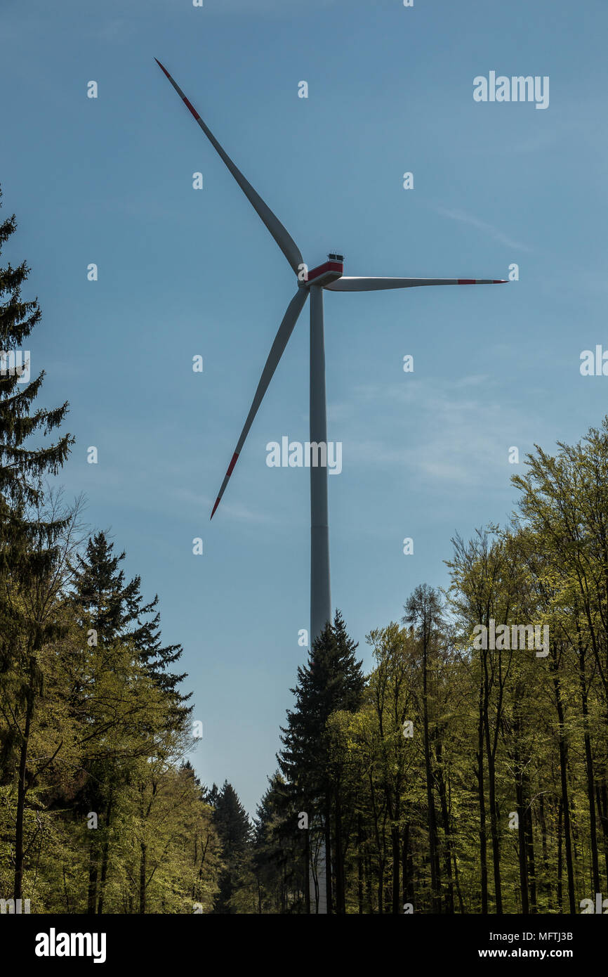 Big windmills for wind power near the village Stock Photo - Alamy