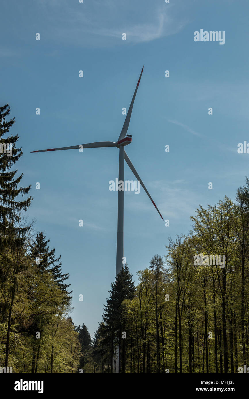 Big windmills for wind power near the village Stock Photo - Alamy