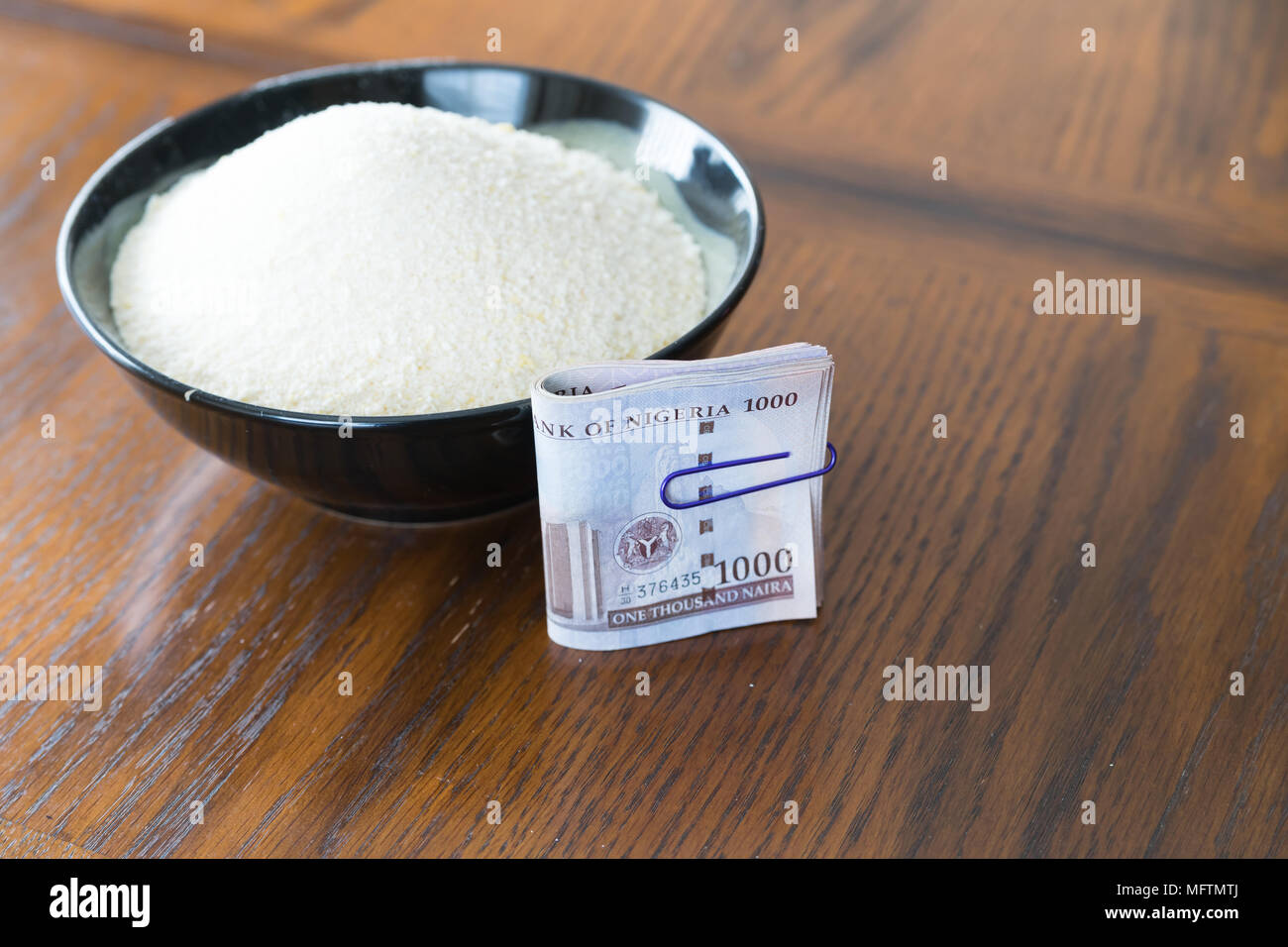 Bowl Of Garri With Nigerian Naira Notes Stock Photo - Alamy