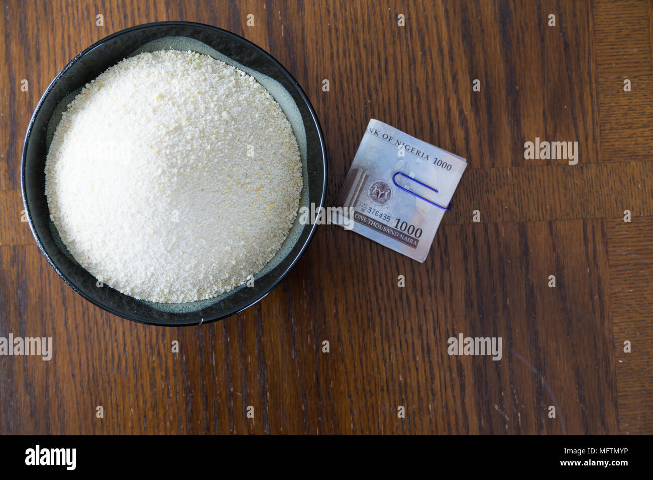 Bowl Of Garri With Nigerian Naira Notes Stock Photo - Alamy