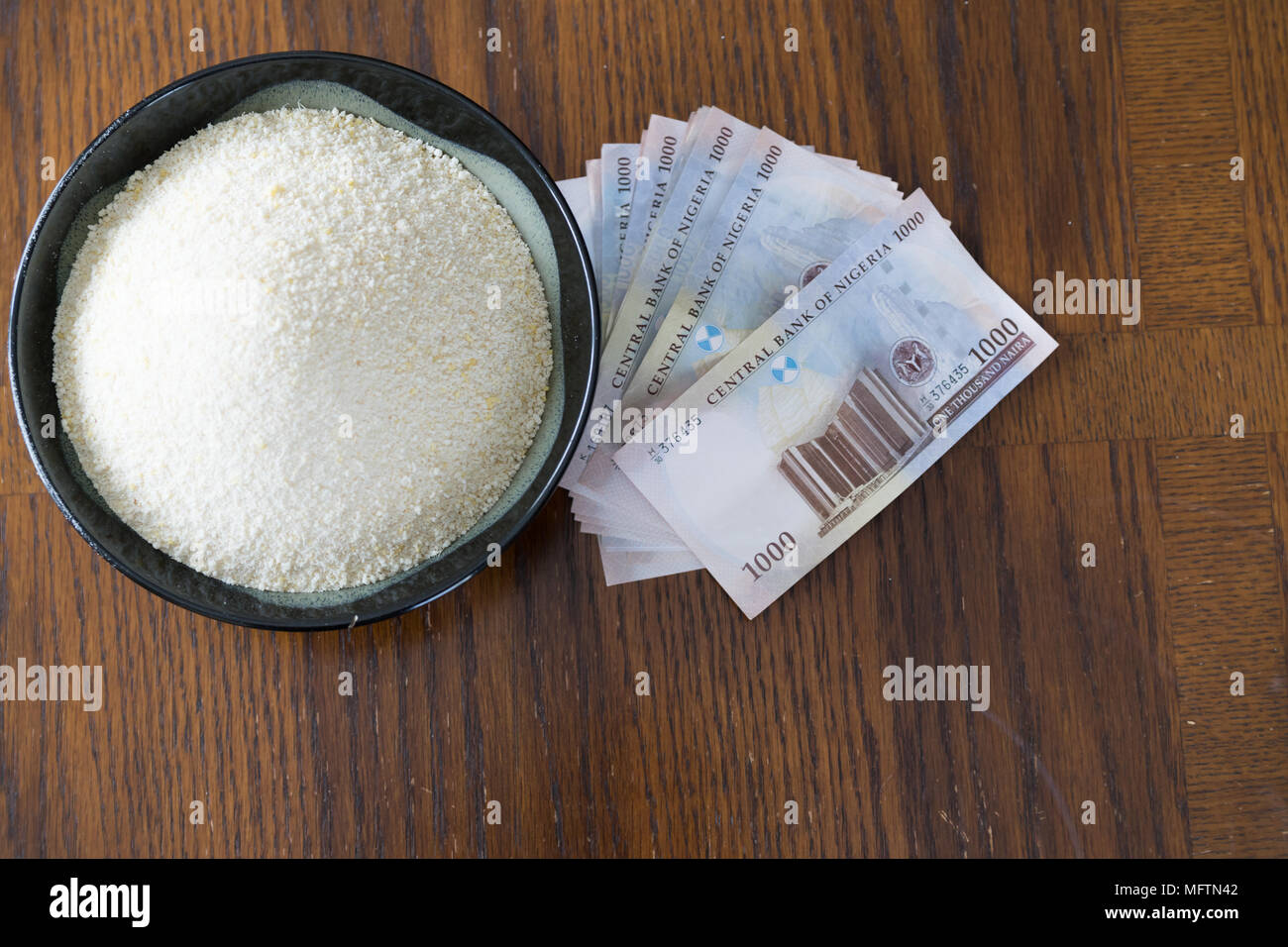 Bowl Of Garri With Nigerian Naira Notes Stock Photo - Alamy