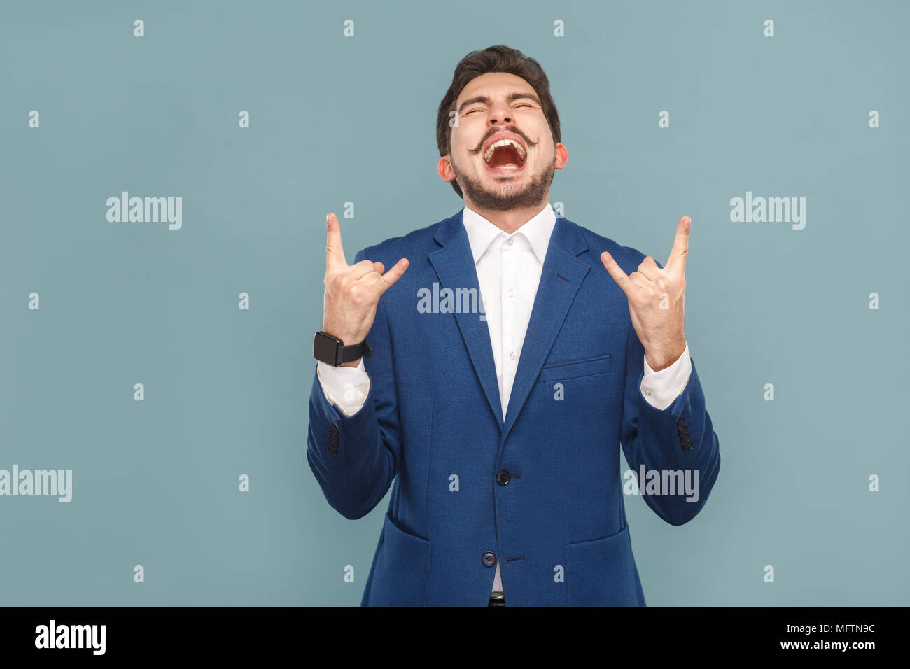 Businessman shout and showing rock and roll sign. Business people ...