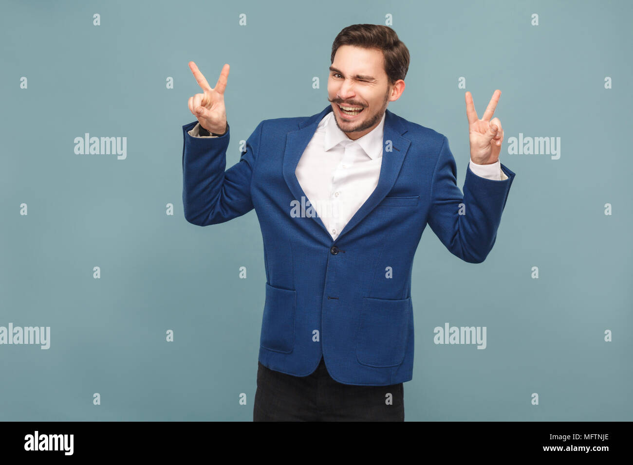 Peace. Business man wink and showing v sign. Business people concept ...