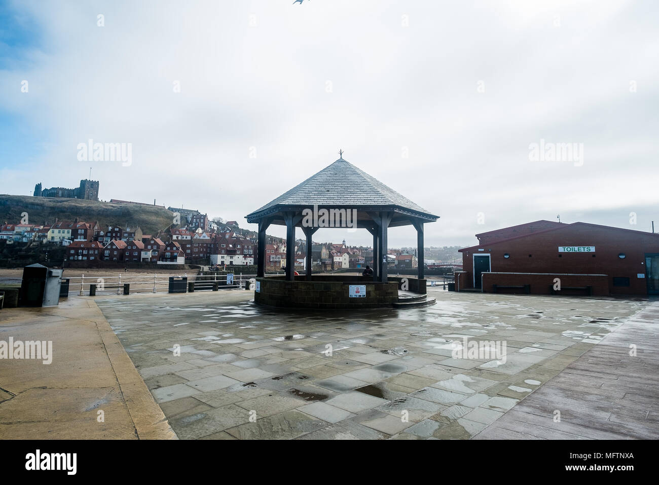 Whitby Abbey and the bandstand on Whitby pier, North Yorkshire, UK ...