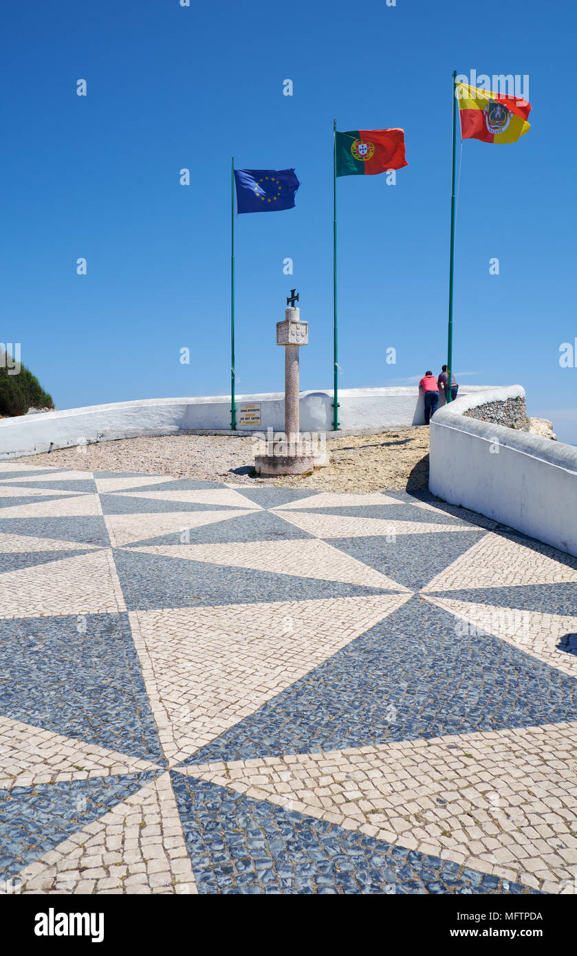 Flags of European Union, Portugal and Nazare fluttering over the ...