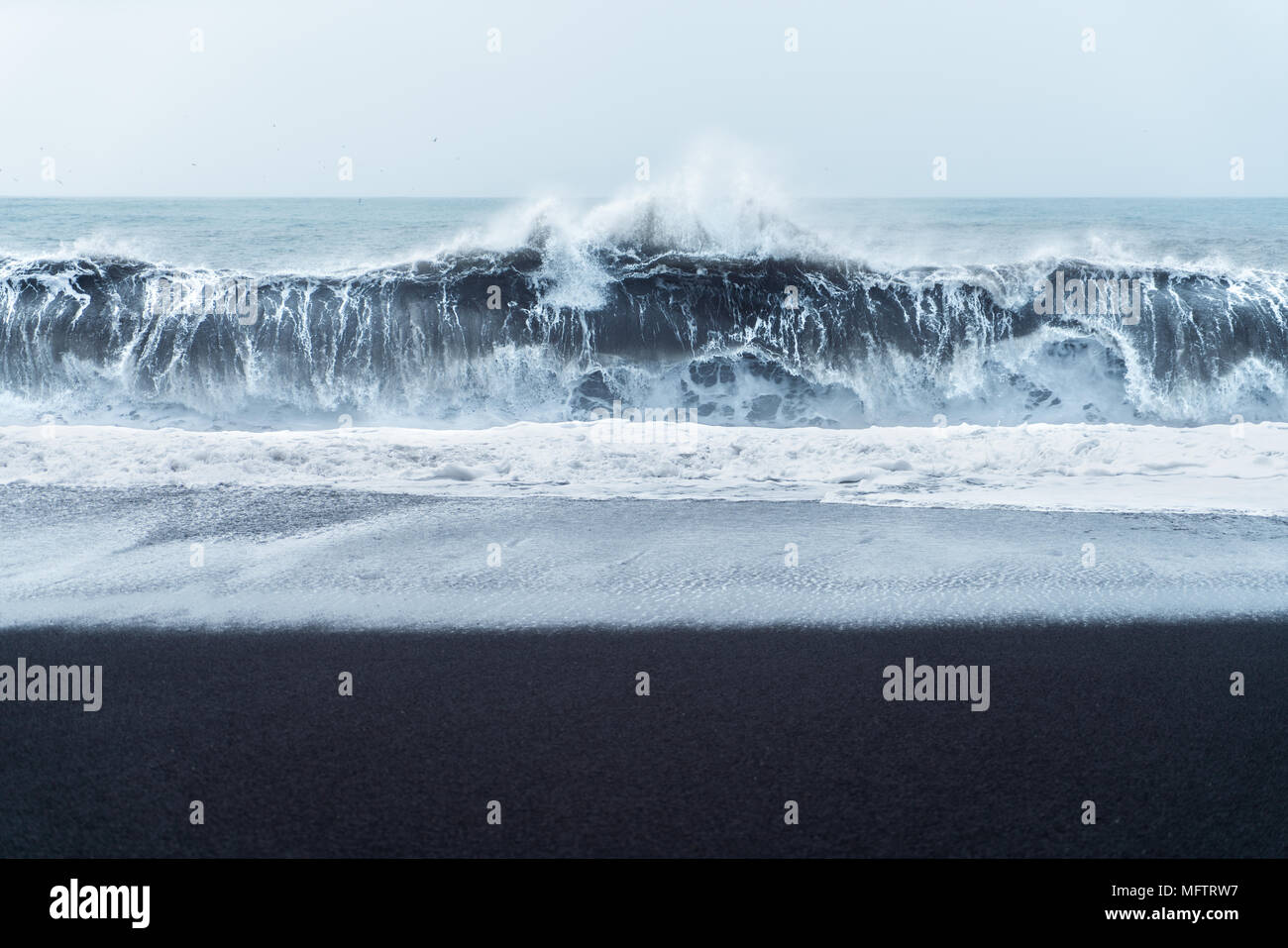 Huge wave hitting the shore Stock Photo - Alamy