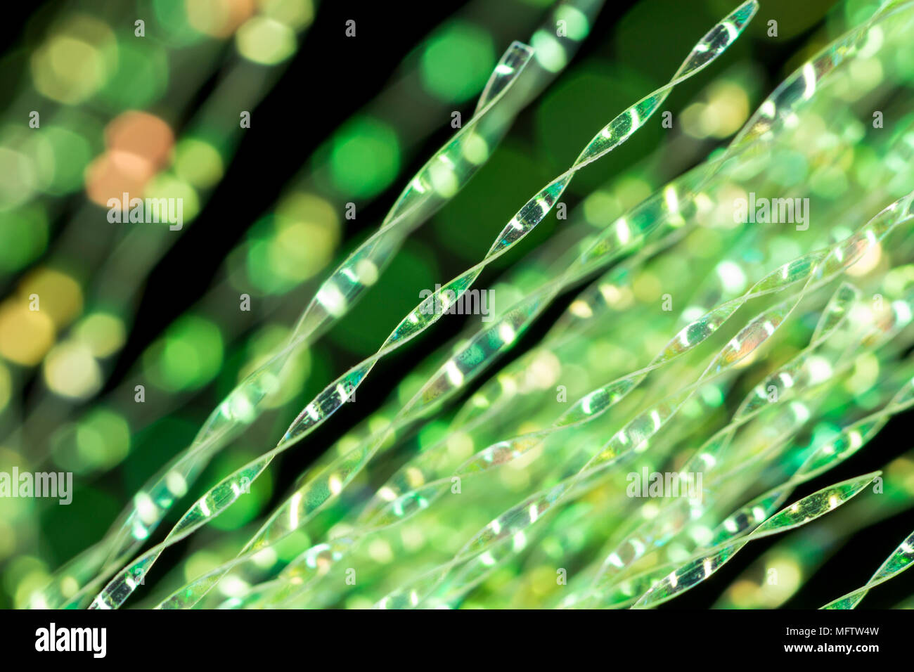 A close-up of flash material used in tying fishing flies. Black ...