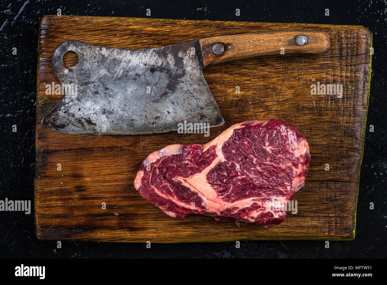 Butcher axe and piece of beef meat steak Stock Photo - Alamy