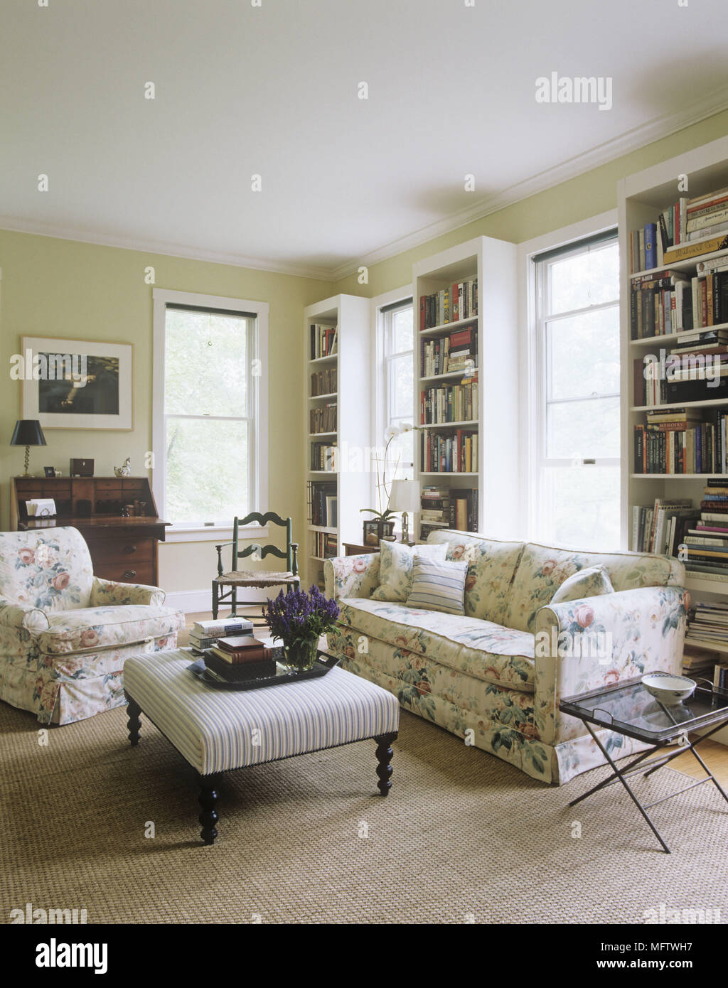 An overview of a traditional country sitting room with upholstered ...