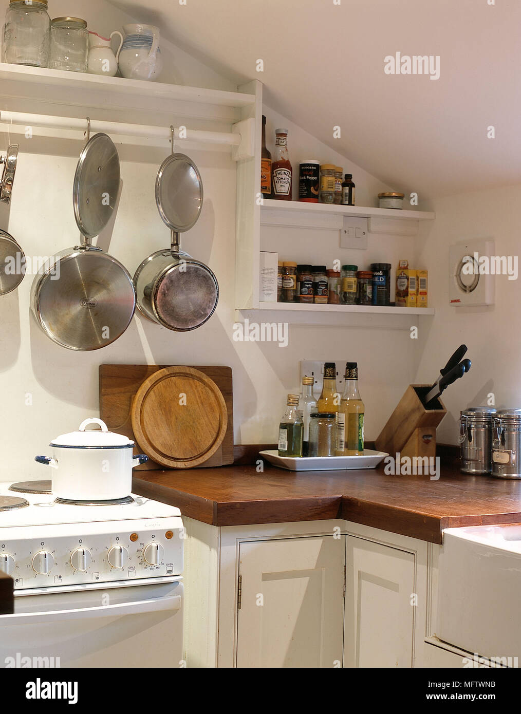 Country style kitchen with neutral colour units Stock Photo - Alamy