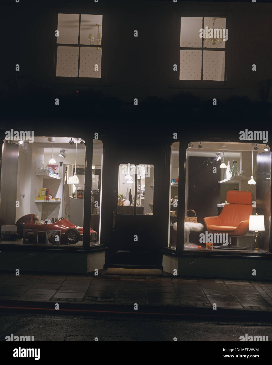 Exterior of a shop at night Stock Photo - Alamy