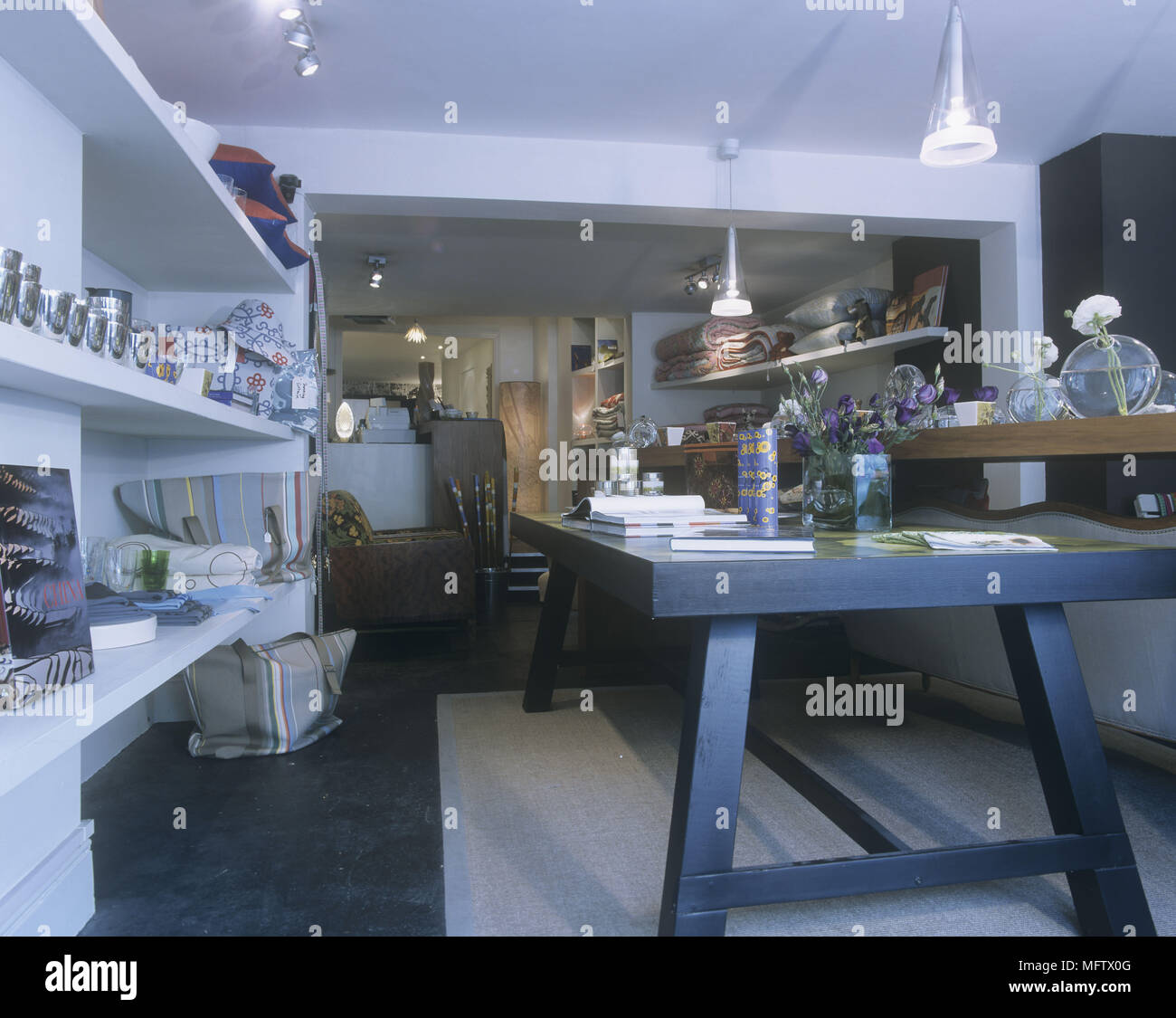 Interior of a shop with various items on shelves and tables Stock Photo ...