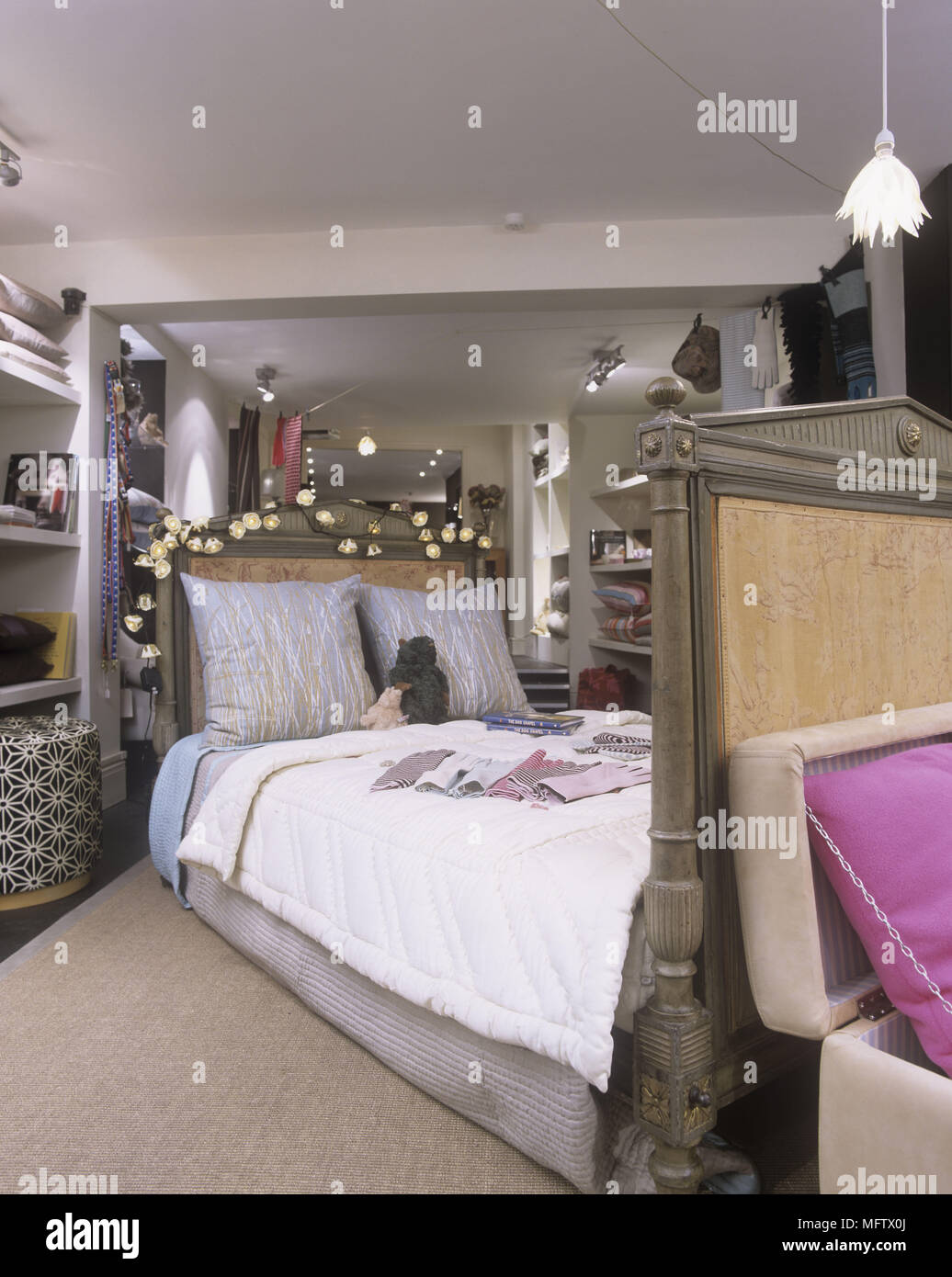 Interior of shop with a bed and various other items Stock Photo - Alamy