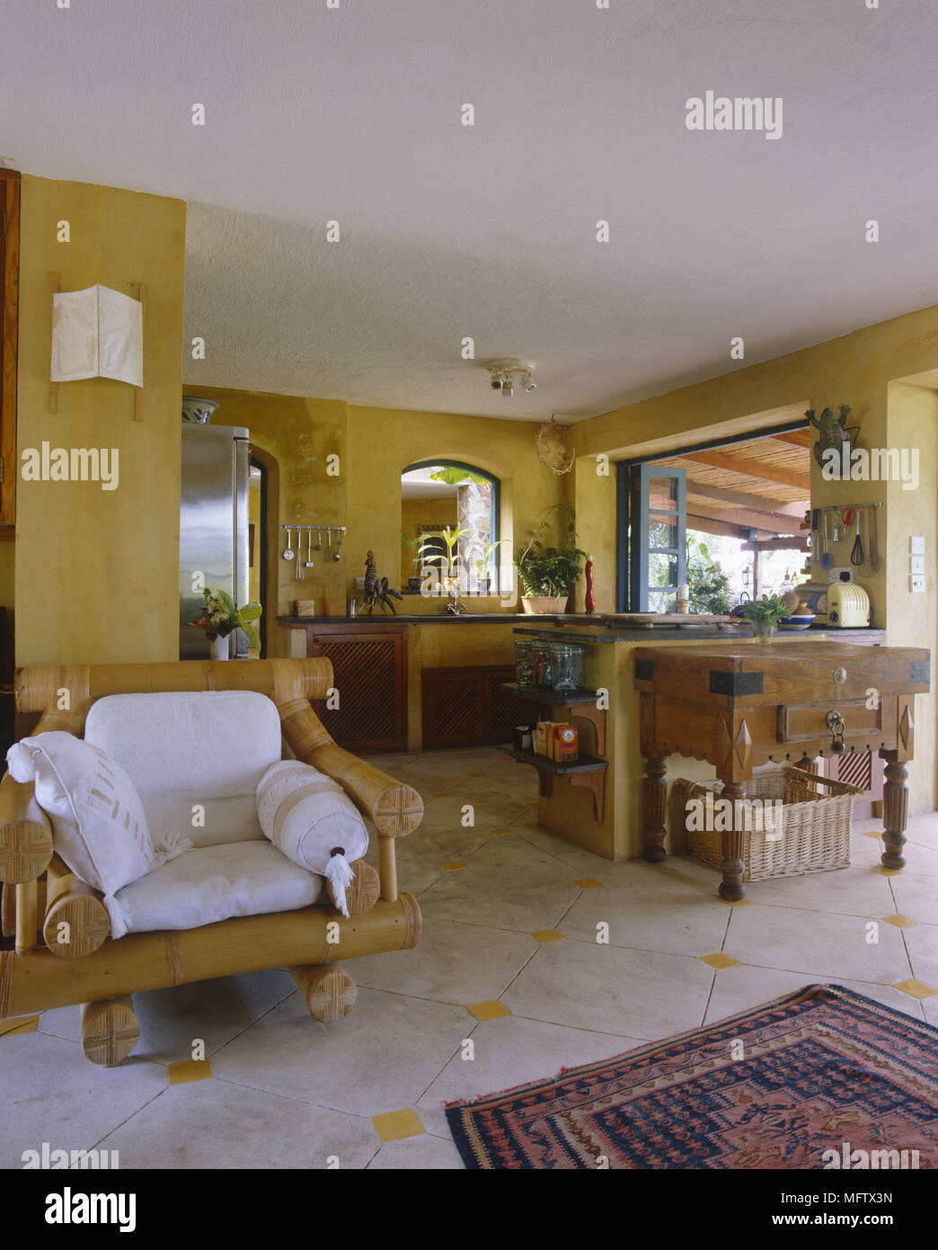 Open plan sitting room kitchen with tiled floor Stock Photo - Alamy