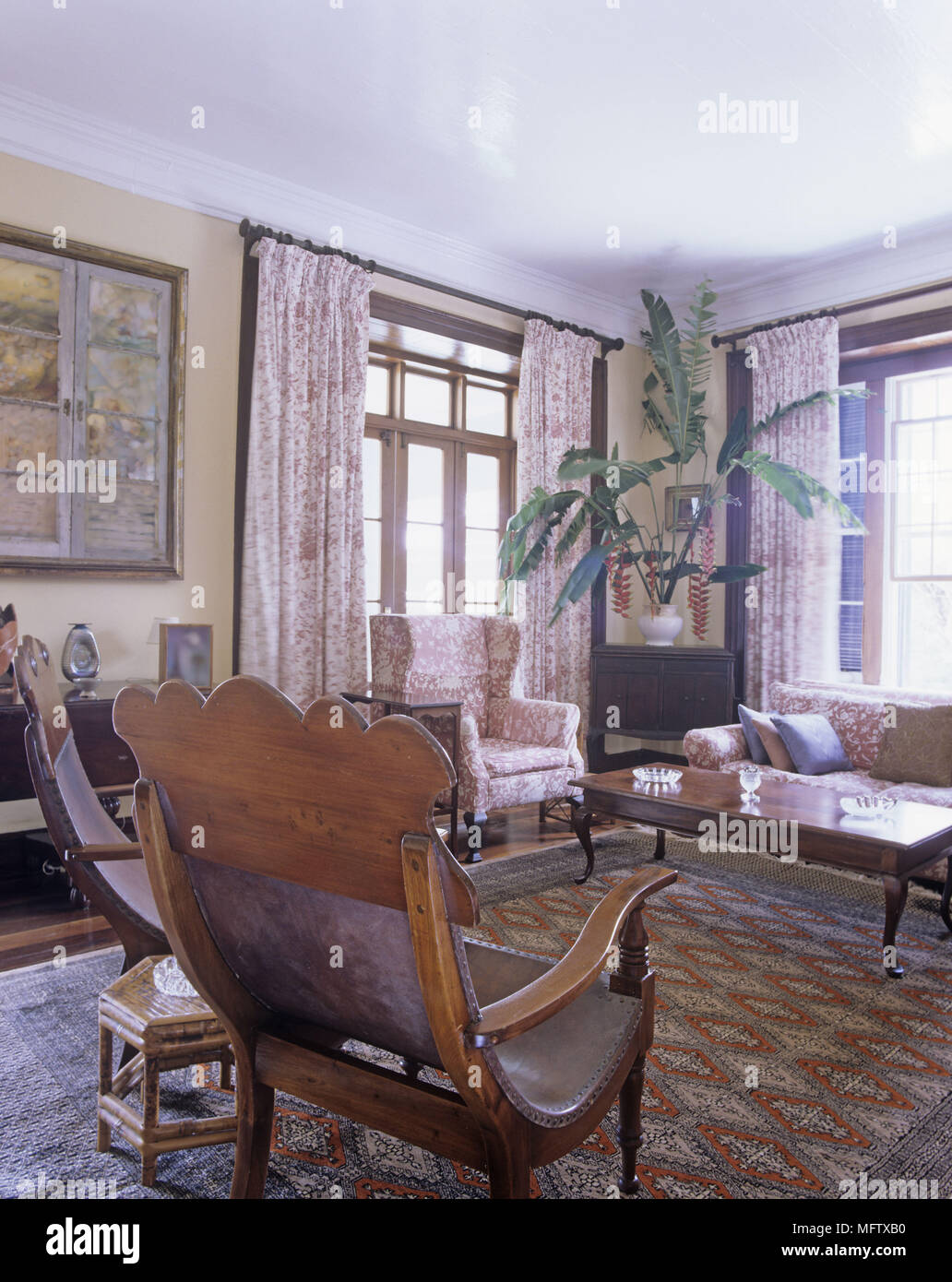 Traditional country sitting room with sofa and chairs large rug and ...