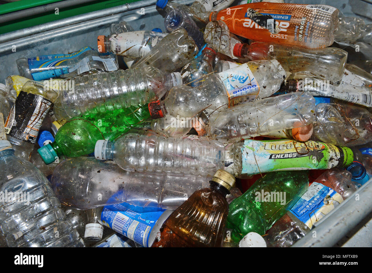 Bins full of wasted discarded plastic bottles from the road side Stock ...